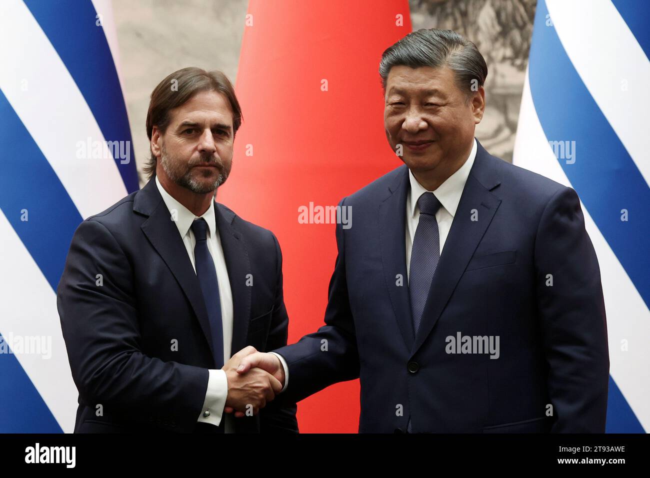 Chinese President Xi Jinping, right, shakes hands with Uruguay President Luis Lacalle Pou ...