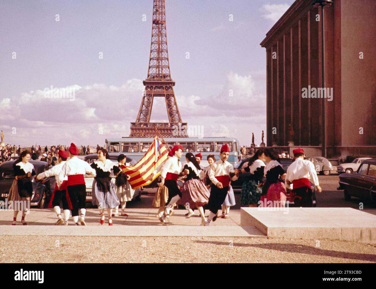 Balkan folk dancers perform by the Eiffel Tower, Paris, France, early ...