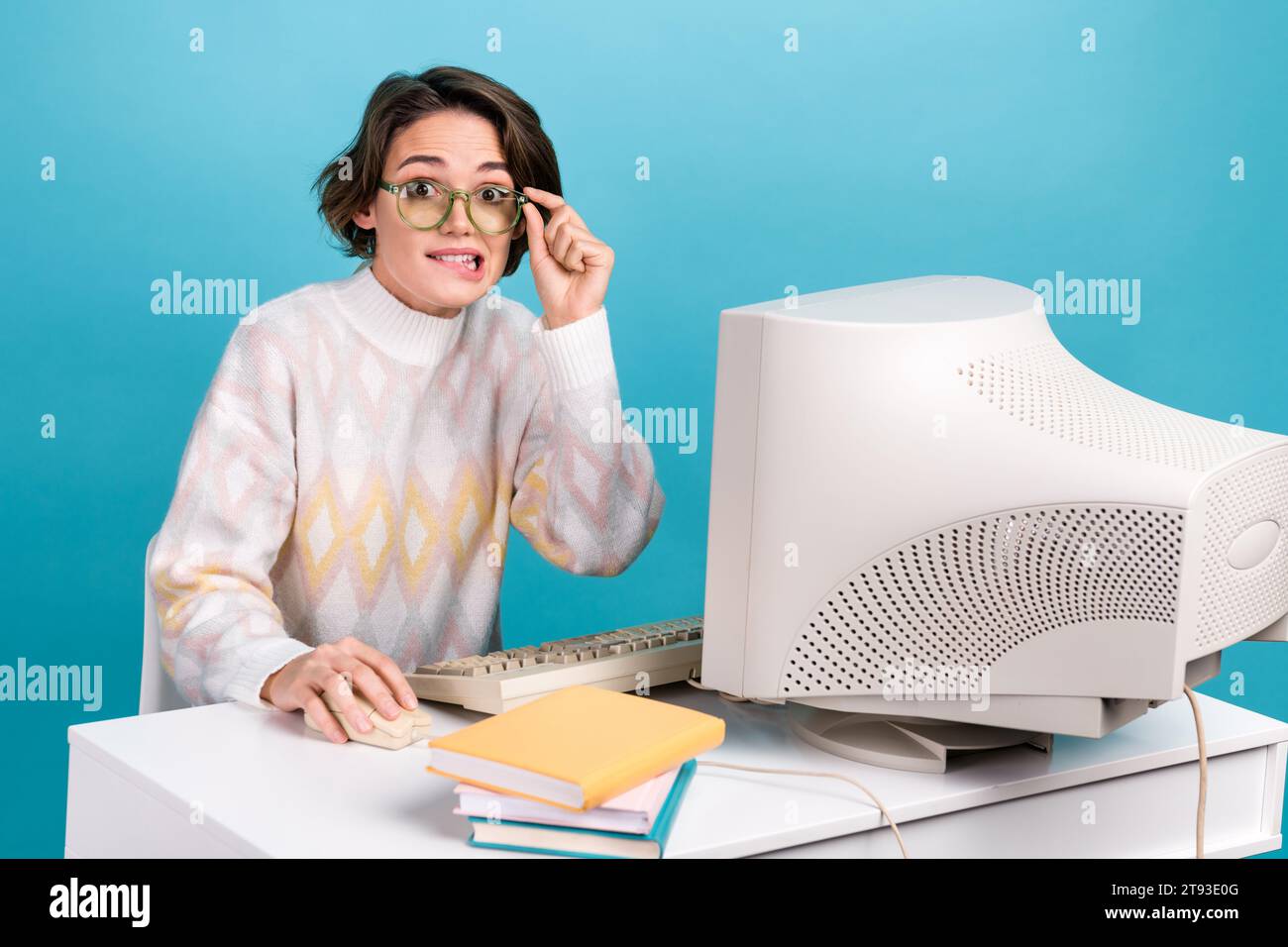 Portrait of clever worried lady arm touch eyewear desktop retro pc ...