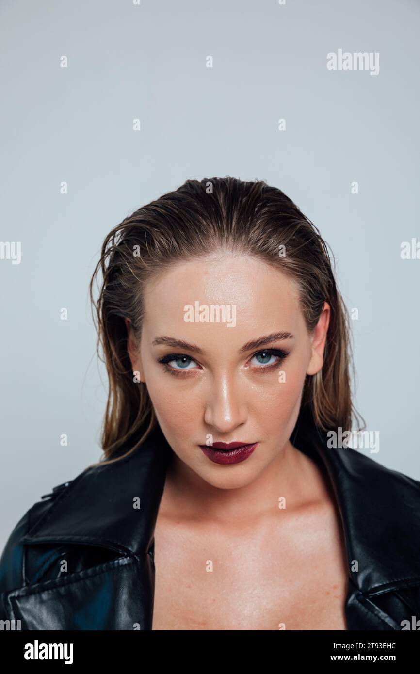 Daring look of a woman on a white background Stock Photo - Alamy