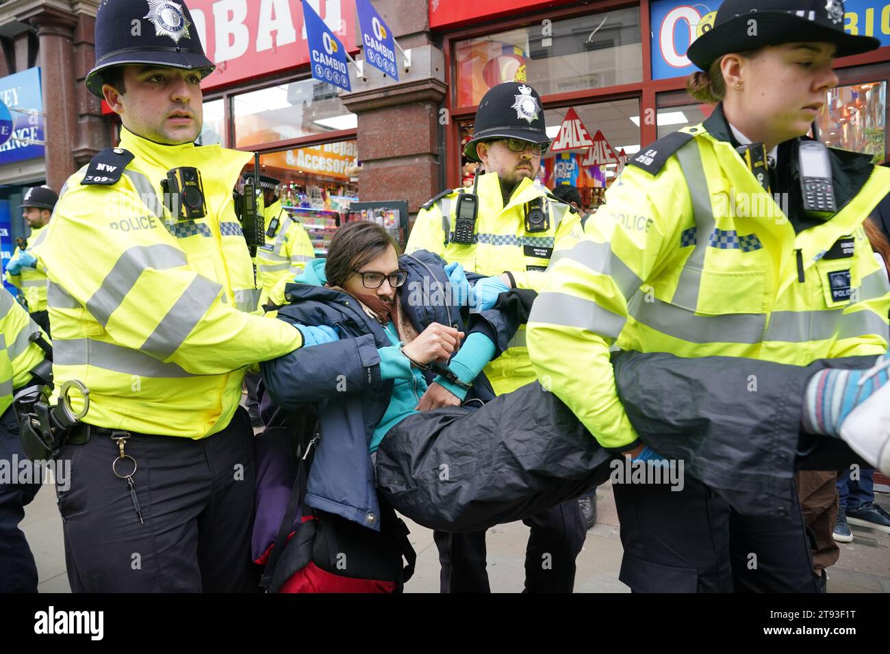 Police officers remove a Just Stop Oil protester who was detained ...