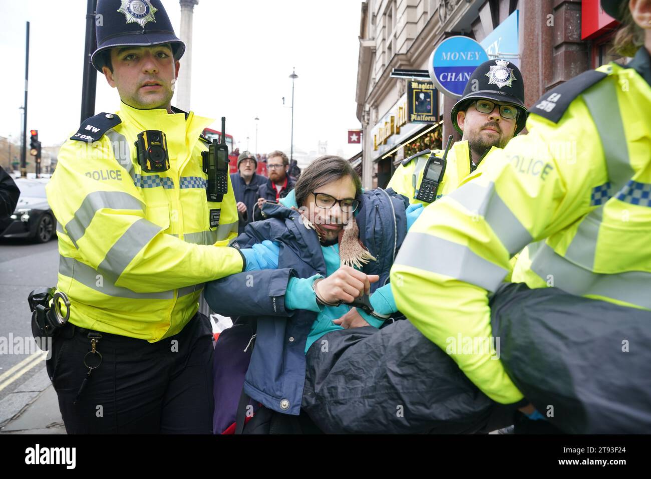 Police officers remove a Just Stop Oil protester who was detained ...