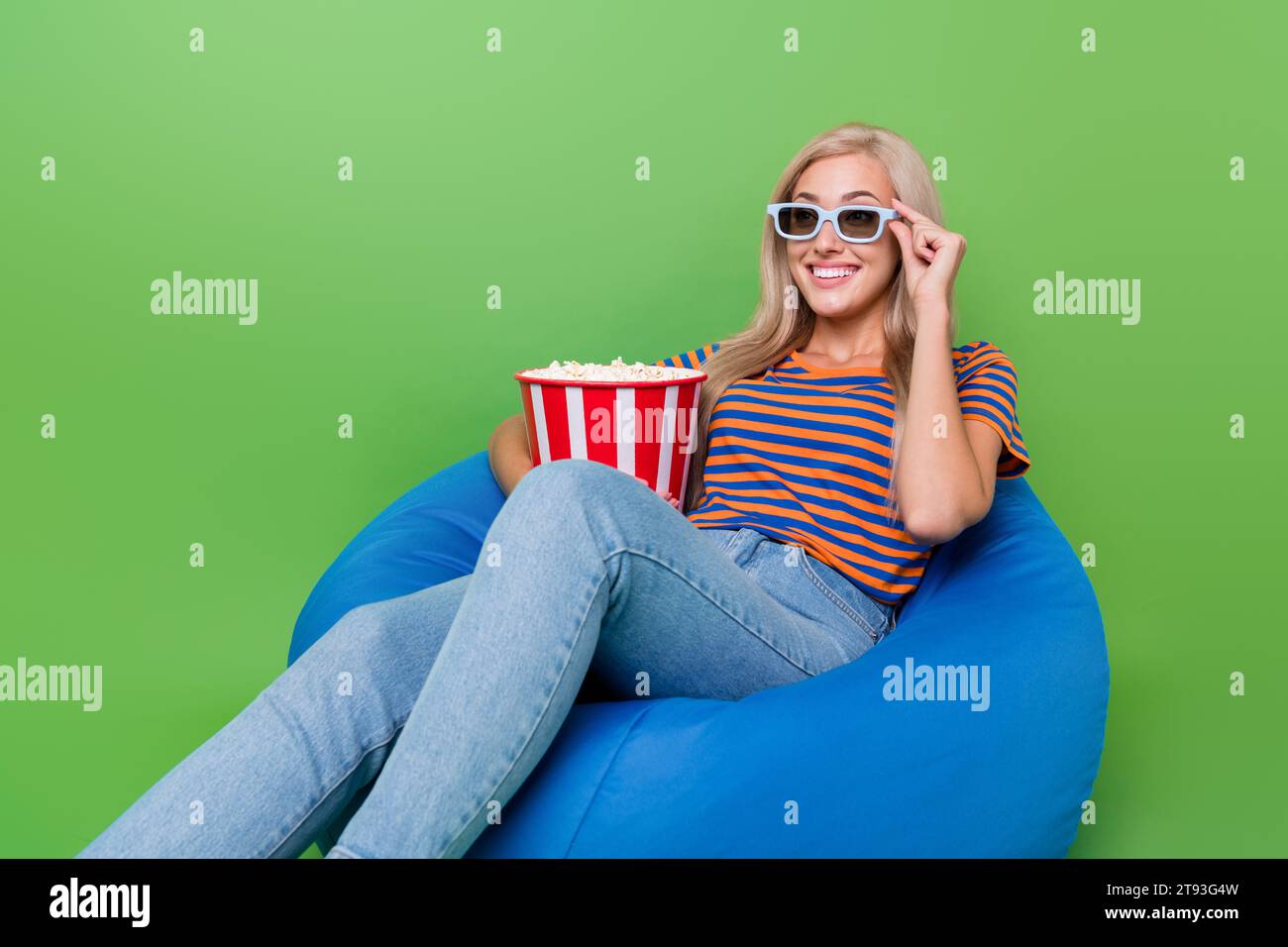 Photo portrait of smile young spectator touching 3d goggles watching ...