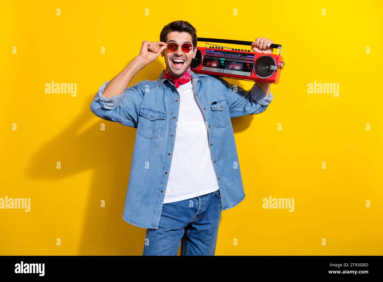 Photo of cool pleasant guy with bristle wear jeans jacket touch glasses ...
