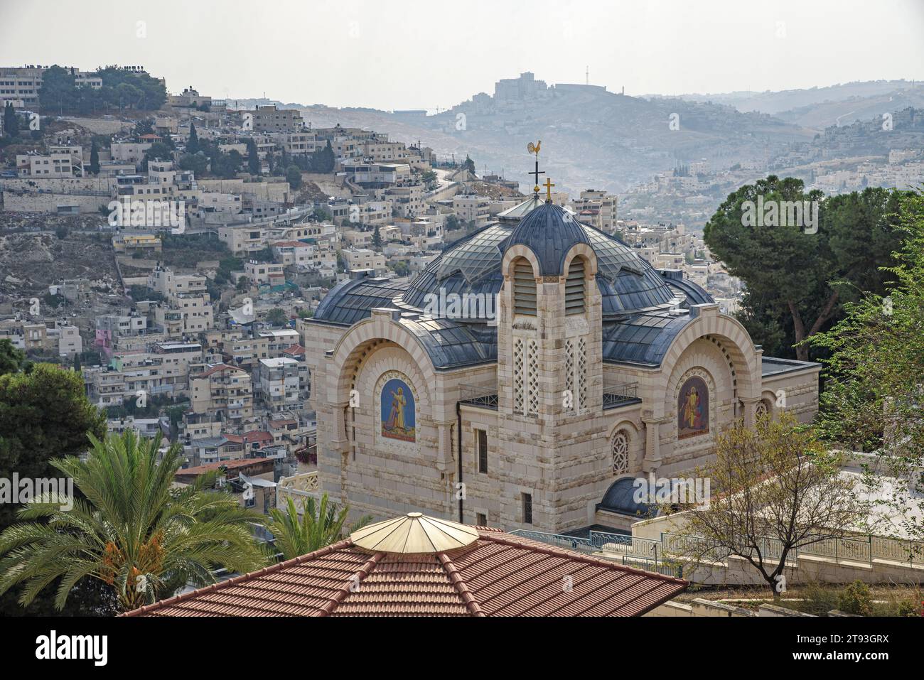 Church of Saint Peter in Gallicantu against the background of poor ...