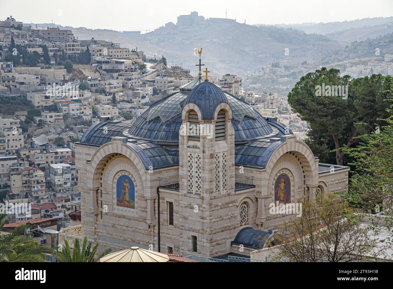 Church of Saint Peter in Gallicantu against the background of poor ...