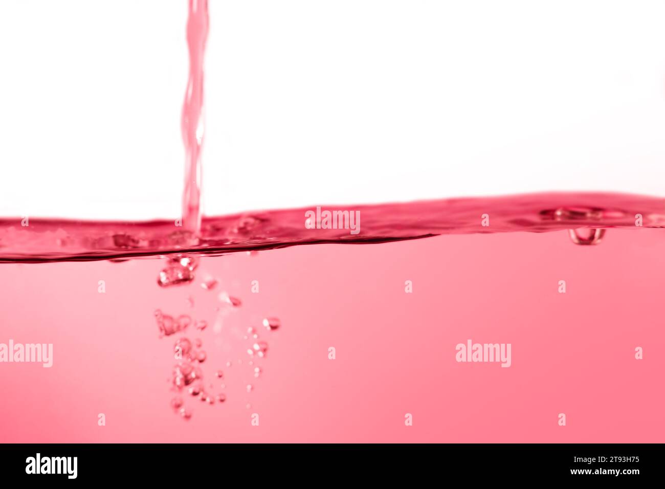 Red water surface with splashes and bubbles on white background Stock ...