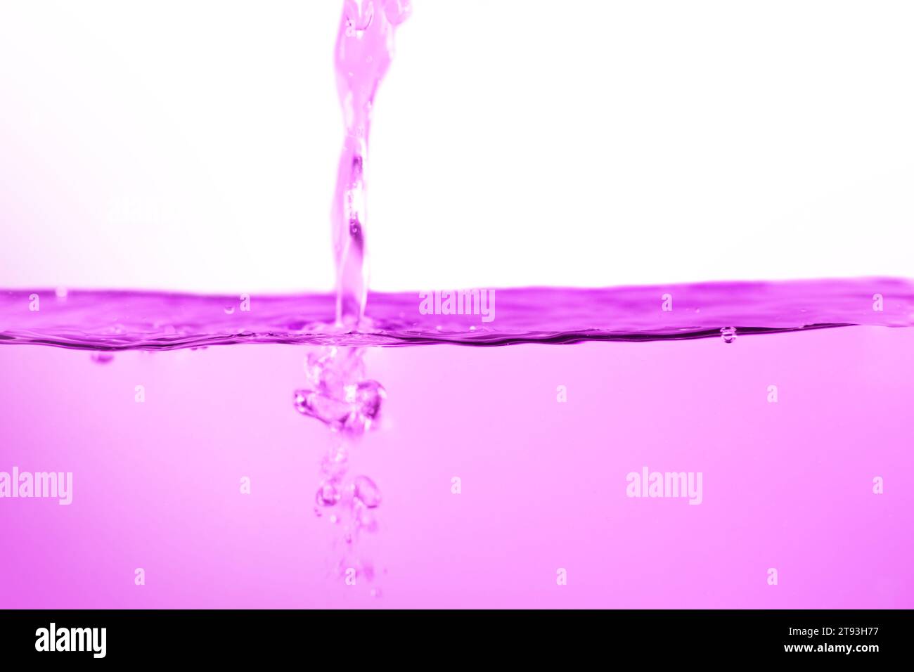 Pink water surface with splashes and bubbles on white background Stock ...