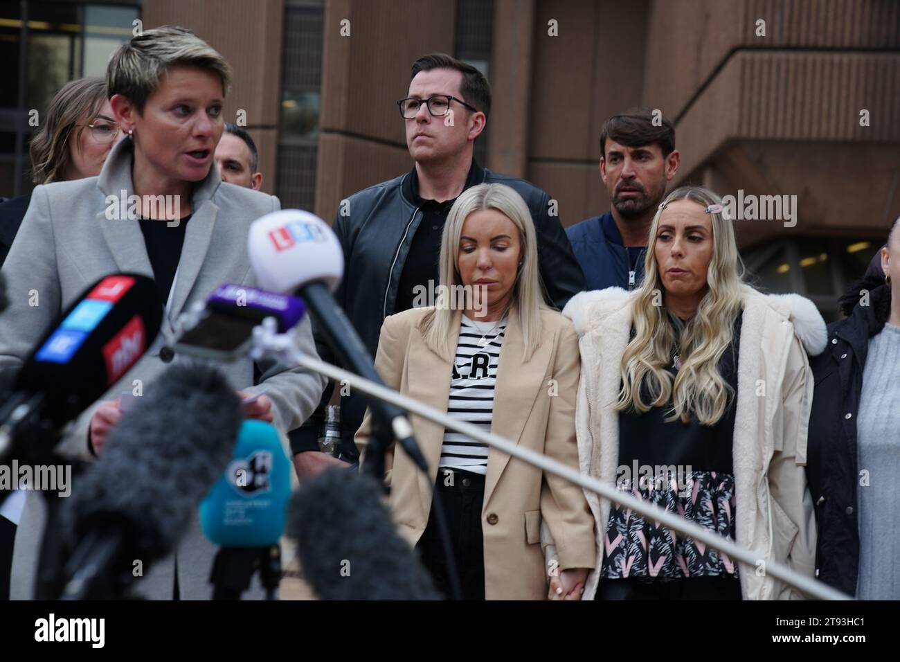 Ashley Dales' mother Julie Dale (centre) listens as a statement is read ...
