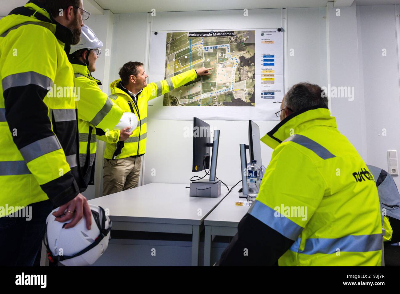 Heide, Germany. 22nd Nov, 2023. Northvolt employees talk in a planning ...
