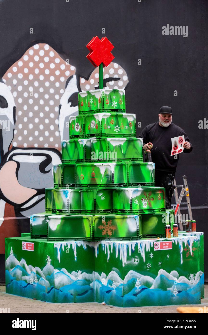 London, UK. 22 November 2023. A graffiti artist at work at the ...