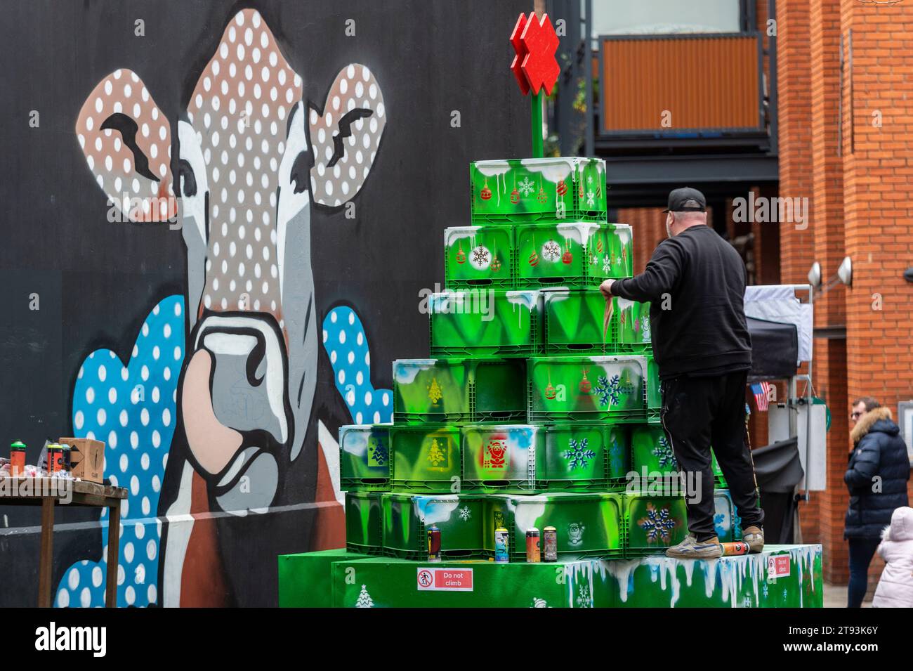 London, UK. 22 November 2023. A graffiti artist at work at the ...