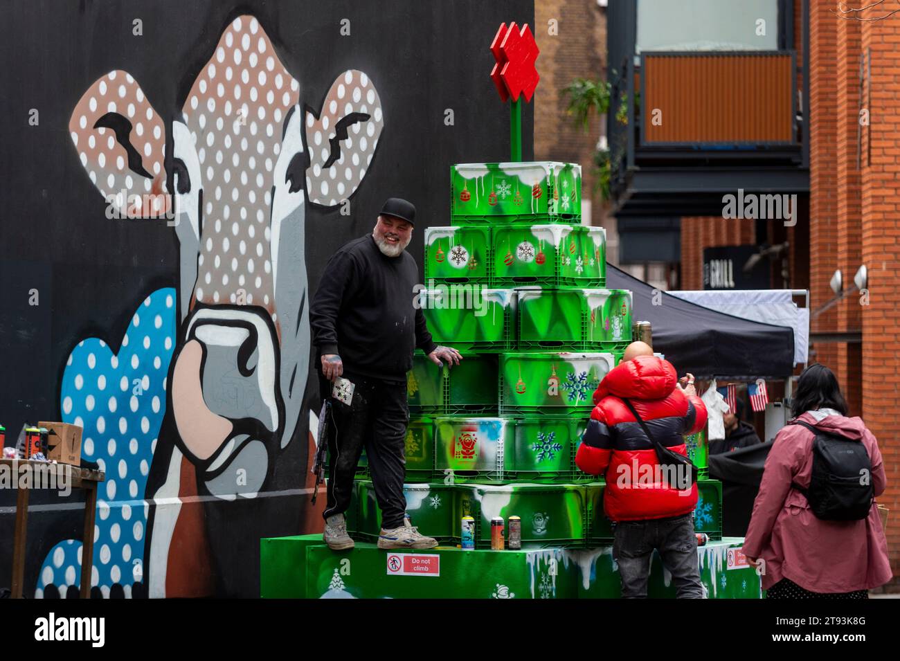 London, UK. 22 November 2023. Graffiti artists at work at the unveiling ...
