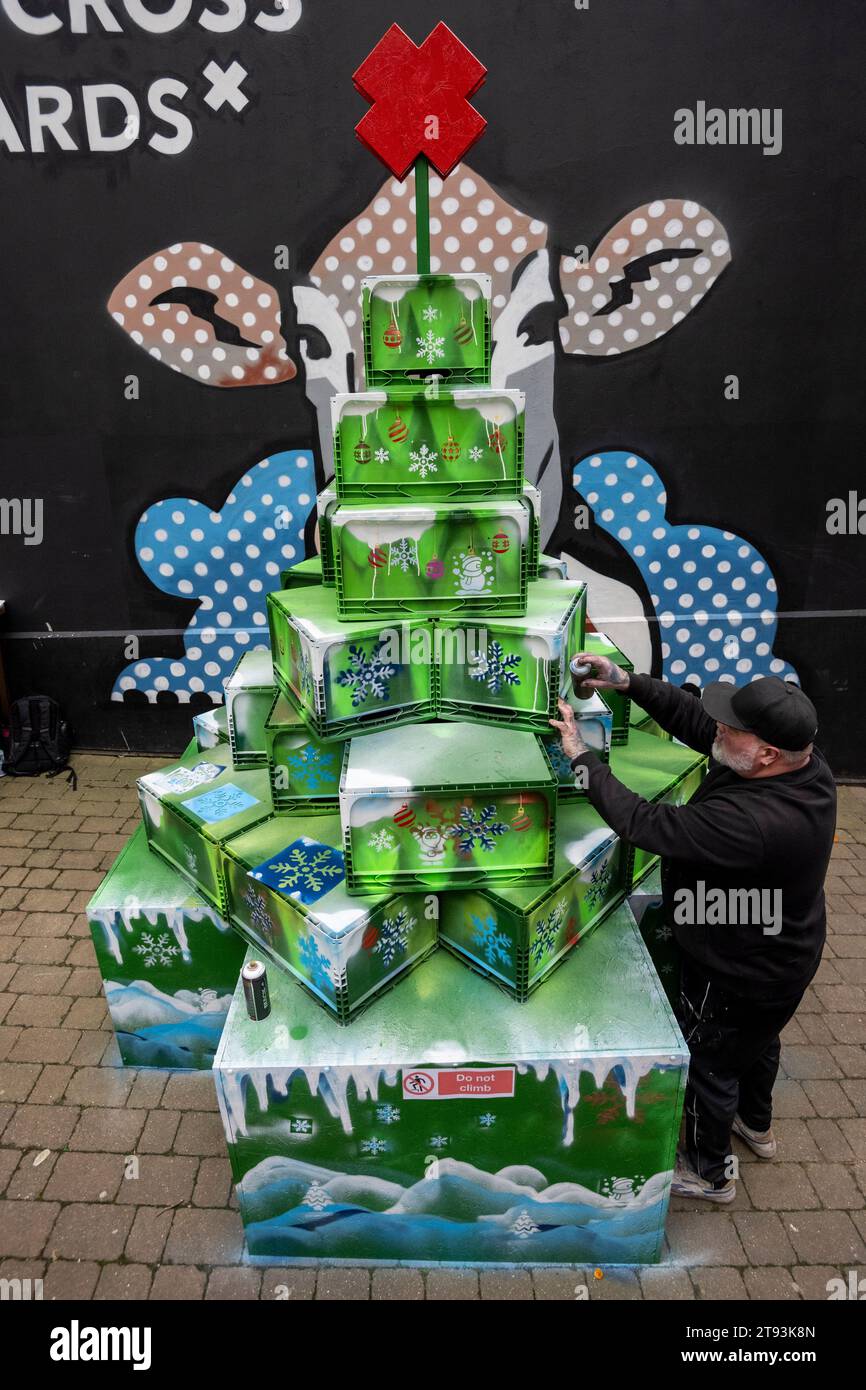 London, UK. 22 November 2023. A graffiti artist at work at the ...