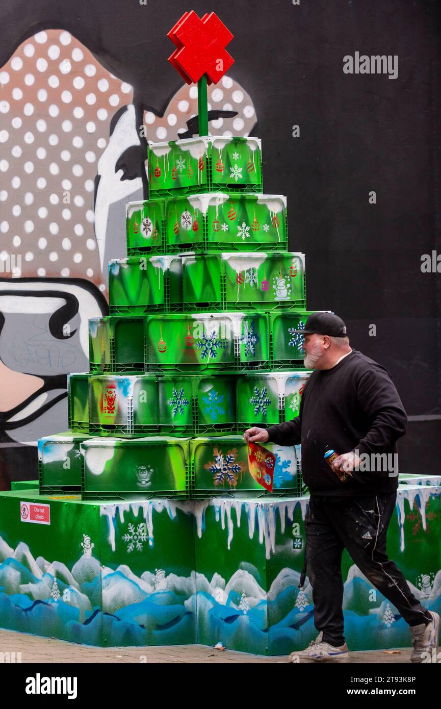 London, UK. 22 November 2023. A graffiti artist at work at the ...