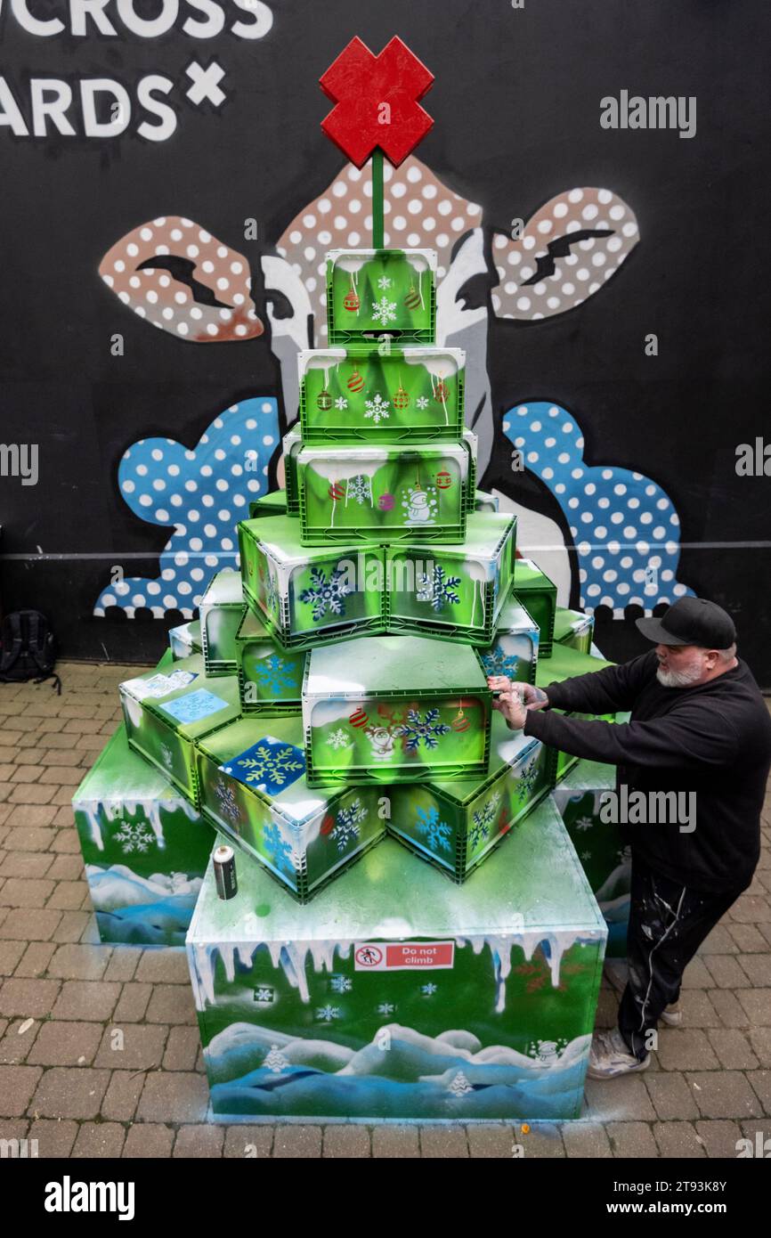 London, UK. 22 November 2023. A graffiti artist at work at the ...