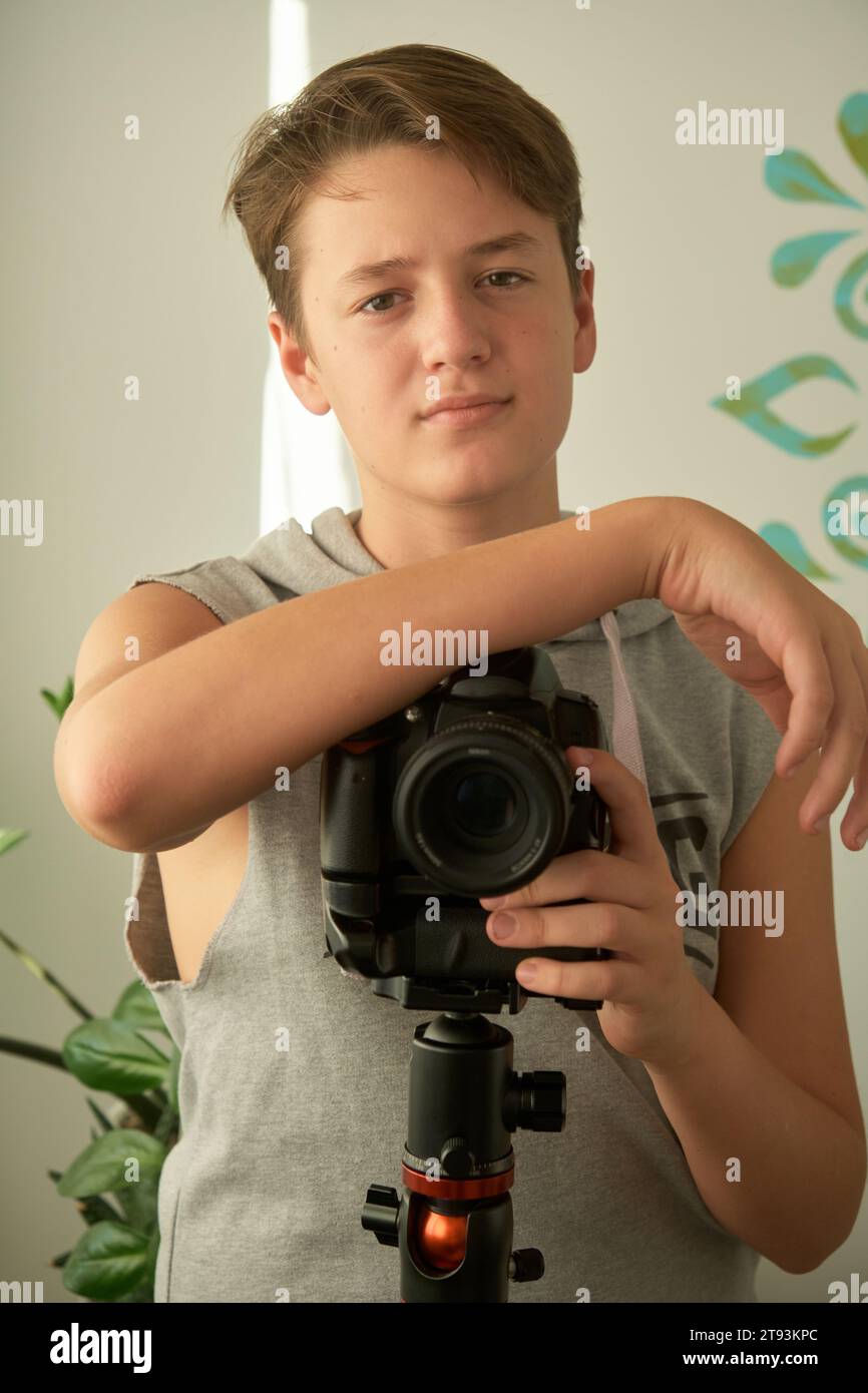 a boy with camera in his hands Stock Photo - Alamy