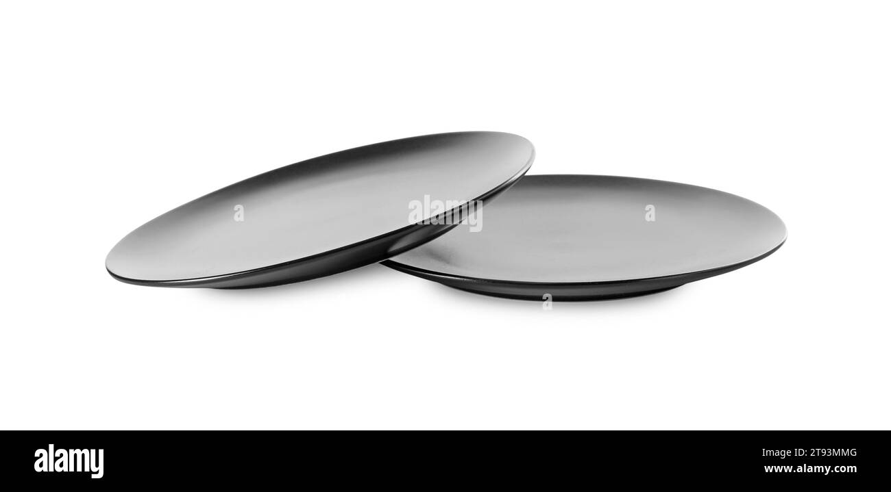 Two clean ceramic plates on white background Stock Photo - Alamy