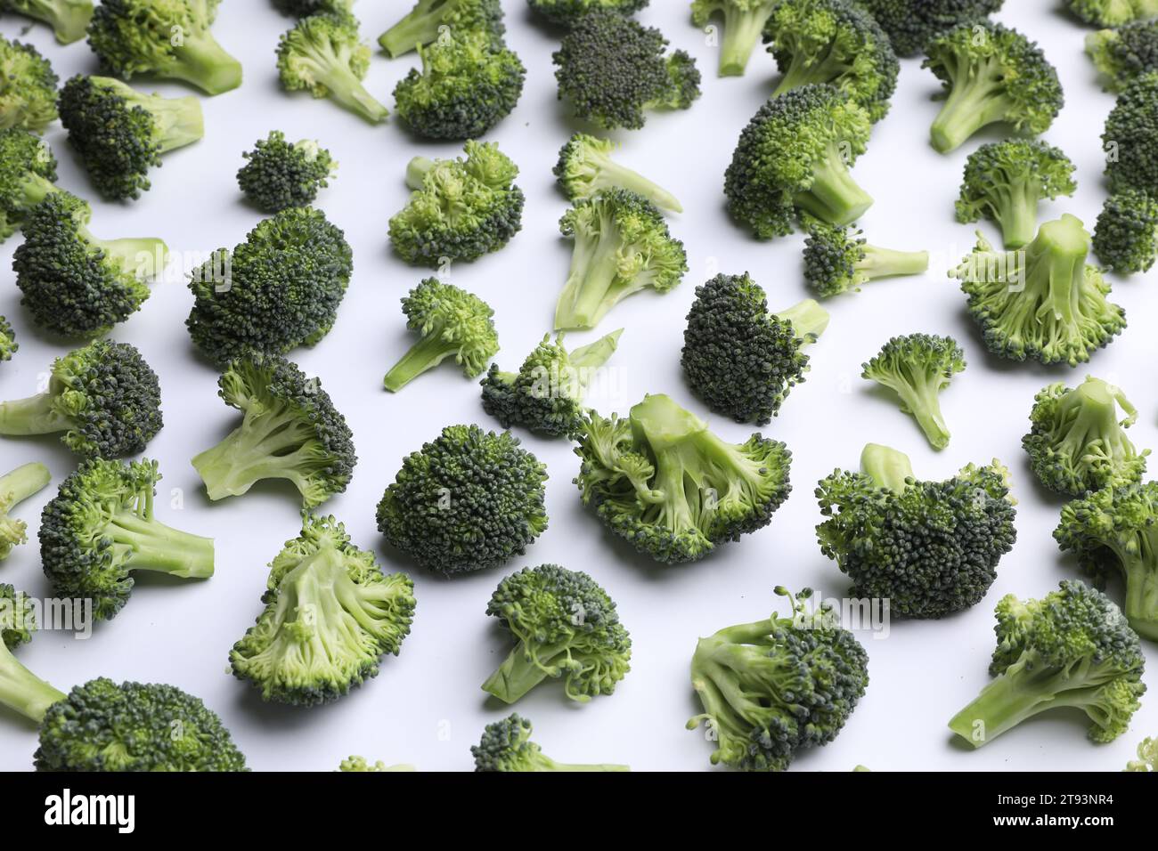 Many fresh green broccoli pieces on white background Stock Photo - Alamy