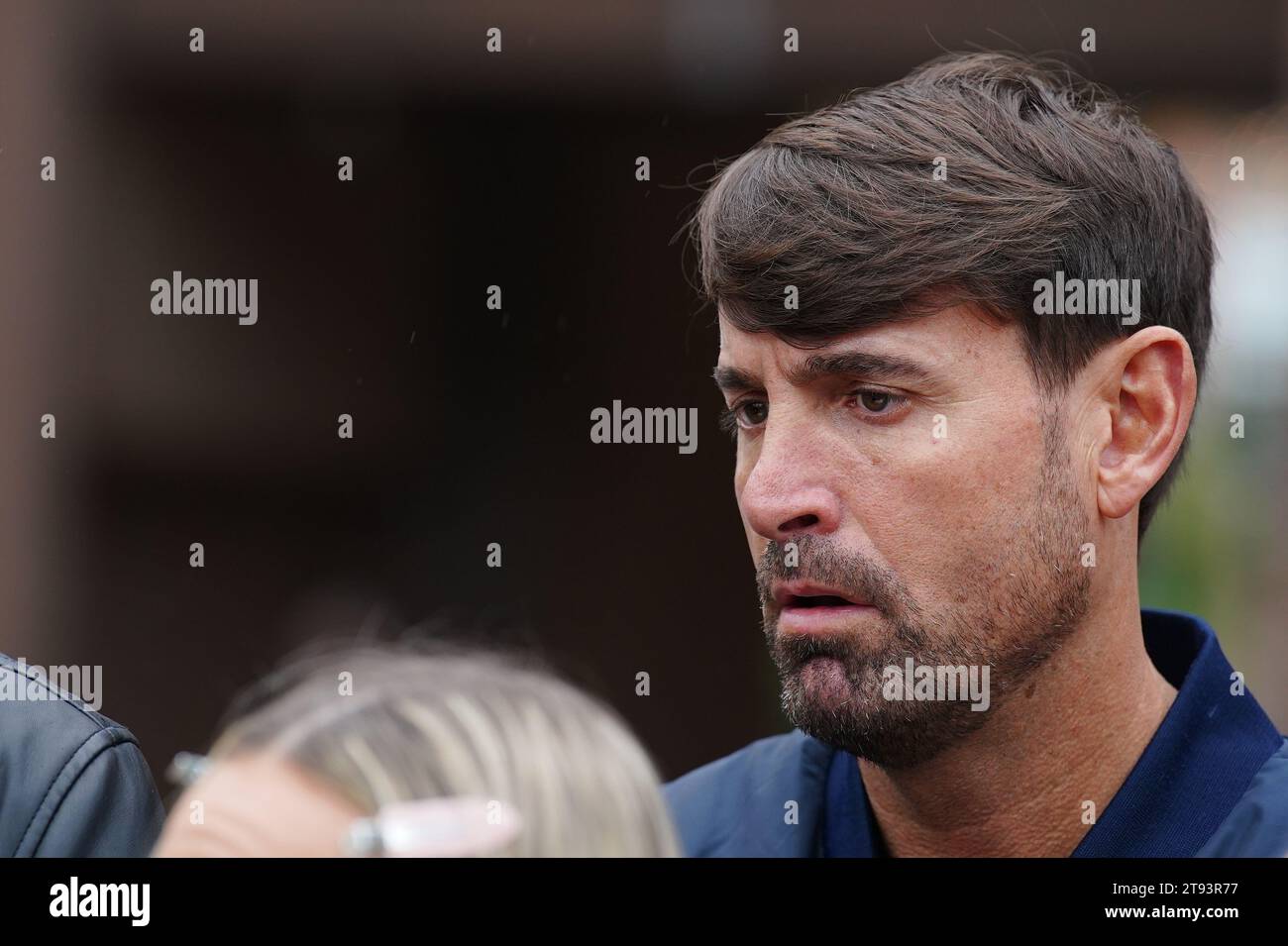 Ashley Dale's father Steve Dunne listens as a statement is read out ...