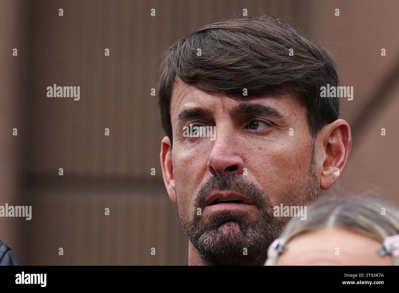 Ashley Dale's father Steve Dunne listens as a statement is read out ...