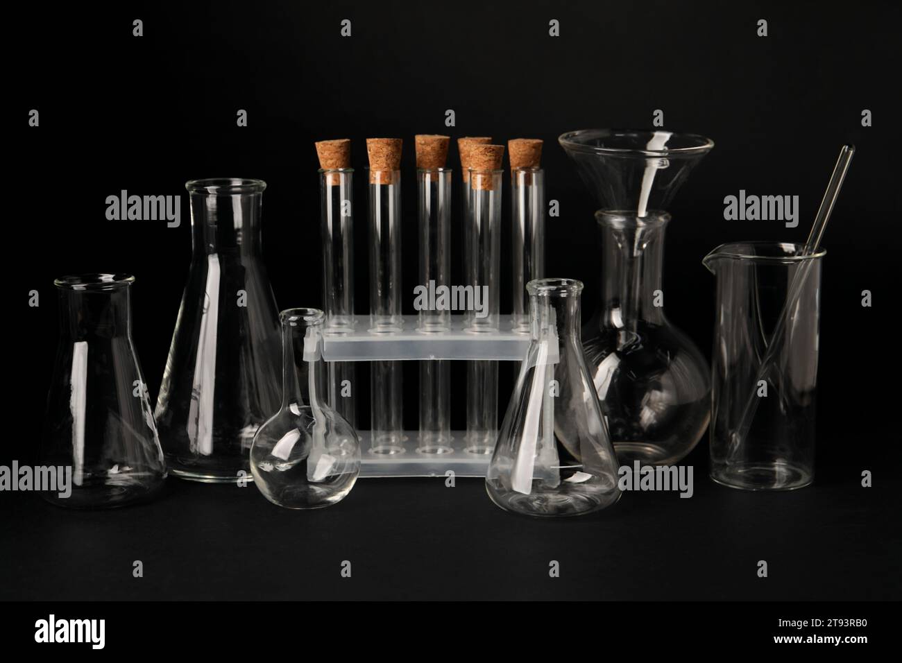 Different laboratory flasks and test tubes on black background Stock ...