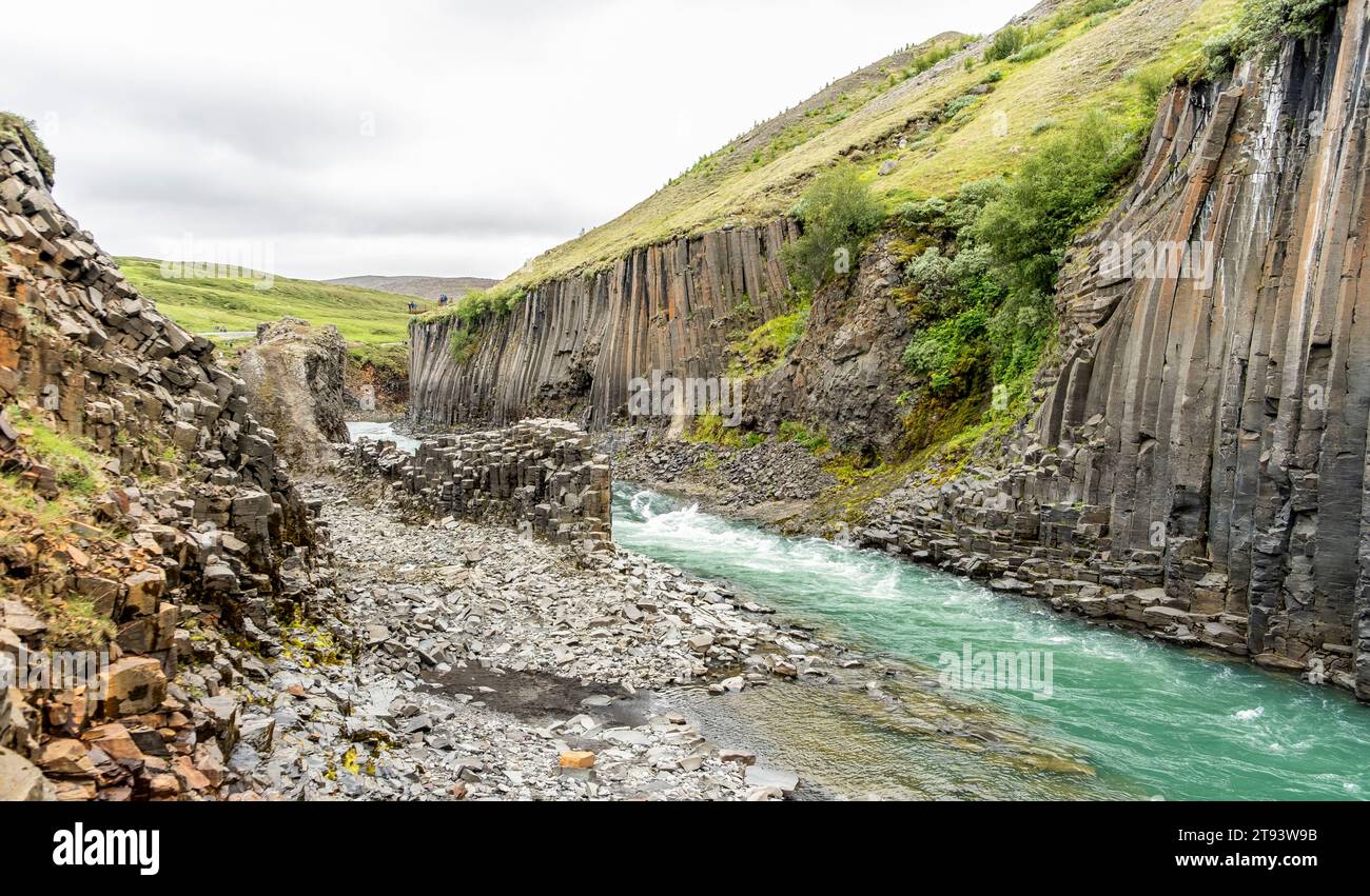 Jokla River cuts through the Studlagil canyon and passes by the ...