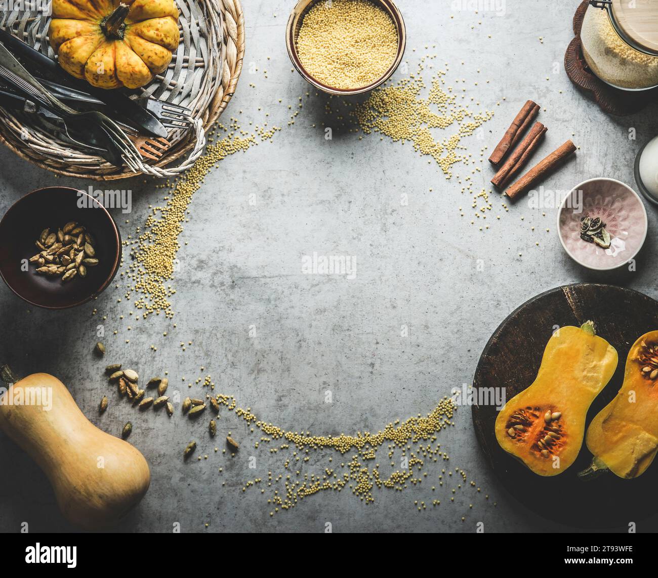 Pumpkin cooking background frame with millet , cinnamon sticks ...