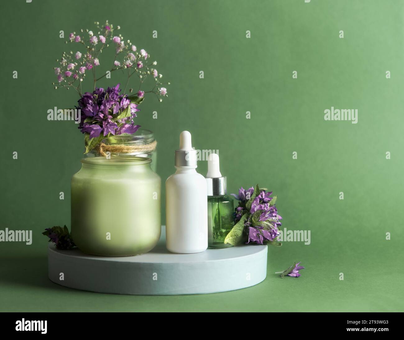 Natural cosmetic product setting with pipette bottle, candle and ...
