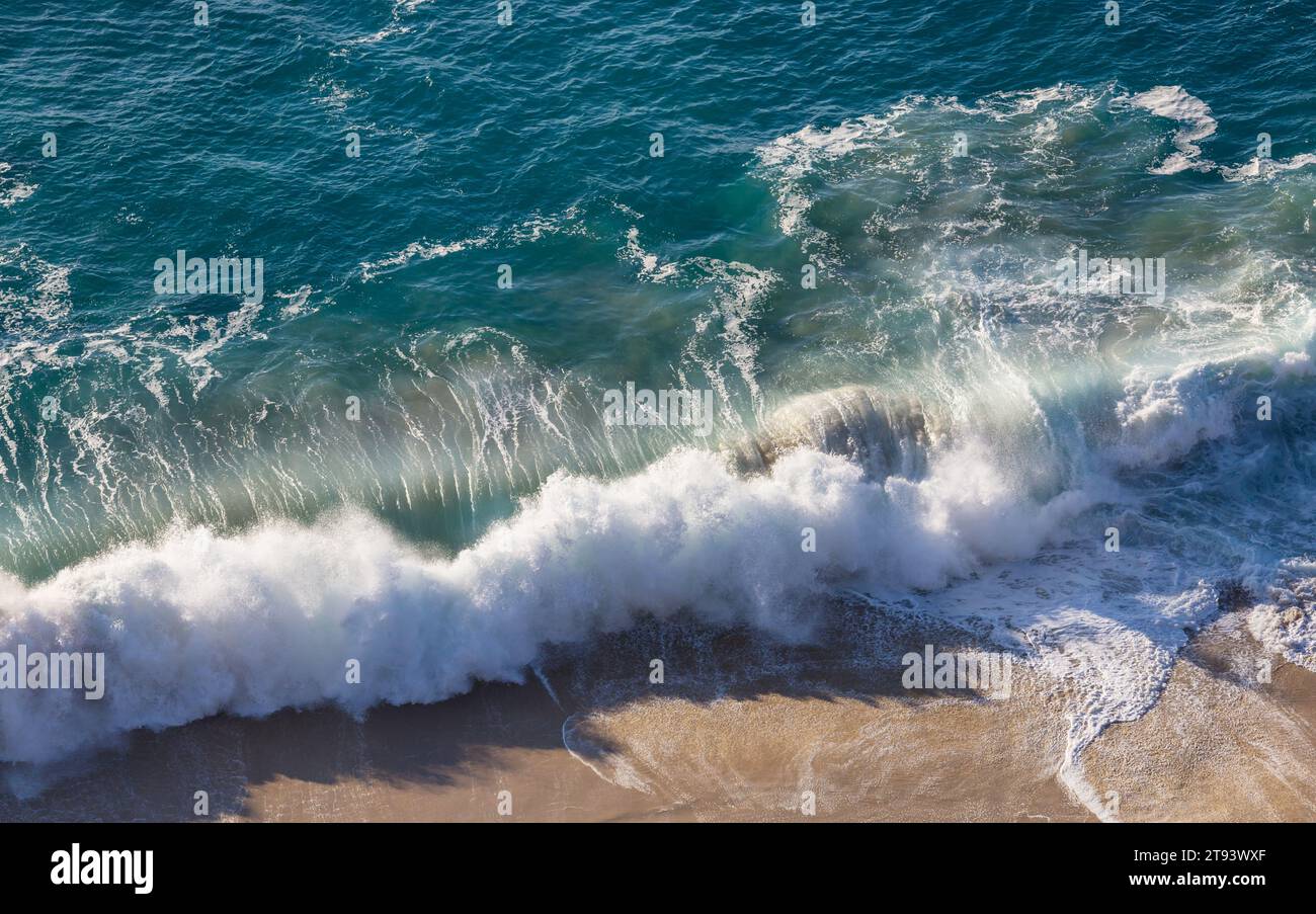 Blue wave on the beach. Dramatic natural background Stock Photo - Alamy
