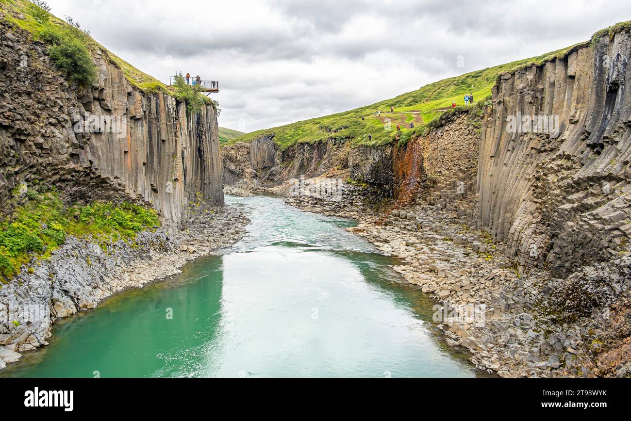 Jokla River cuts through the Studlagil canyon and passes by the ...