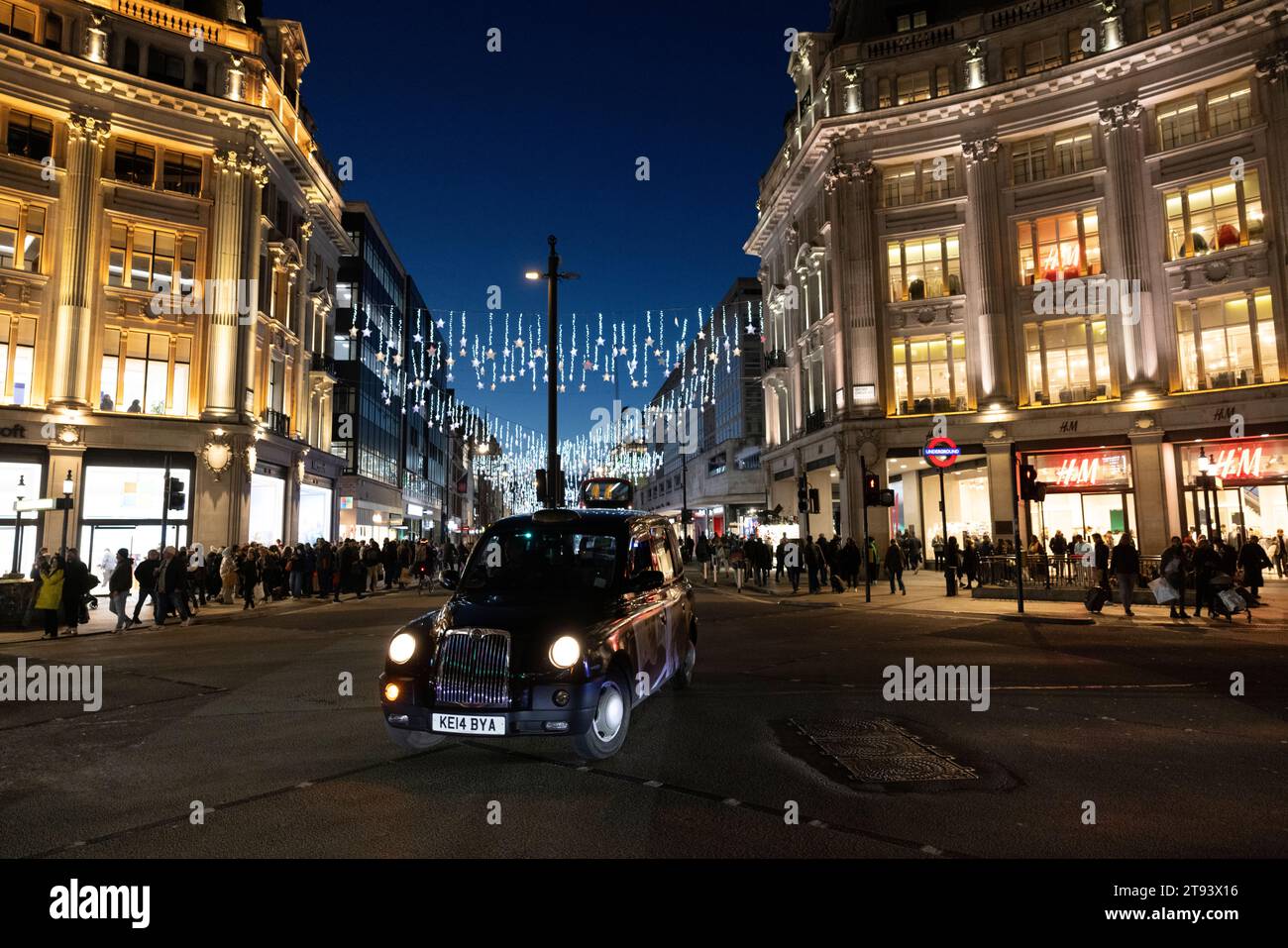London commuters on a London Bus at dusk on Oxford Street in London's ...