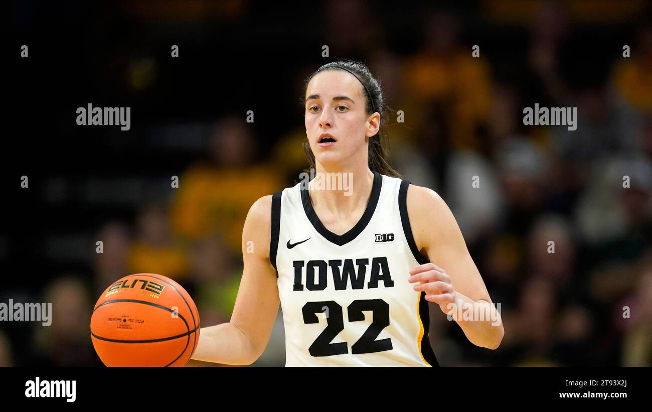 Iowa guard Caitlin Clark (22) drives up court during an NCAA college ...