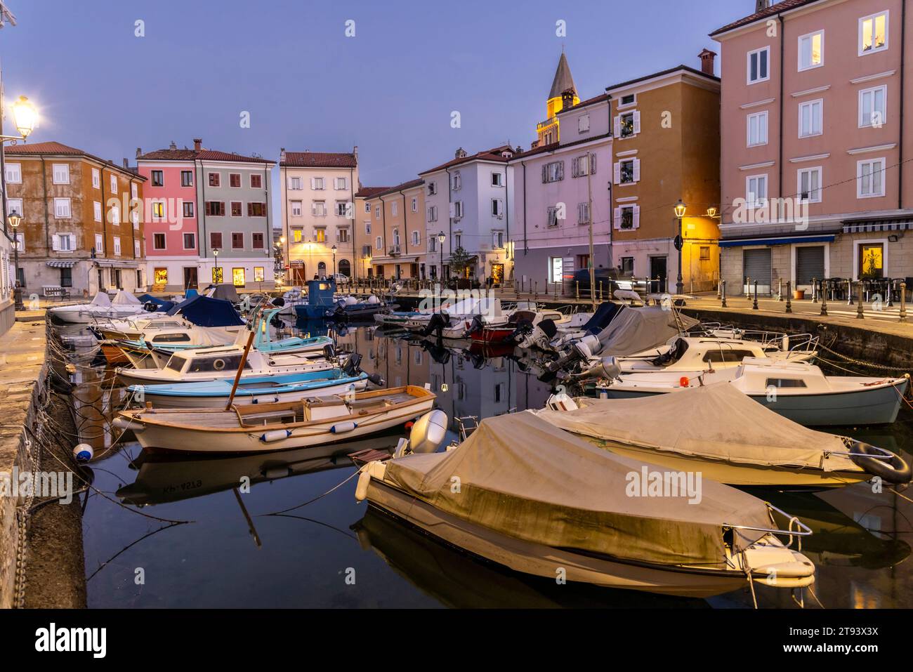 Evening atmosphere in the old harbour of Muggia, a coastal town near ...
