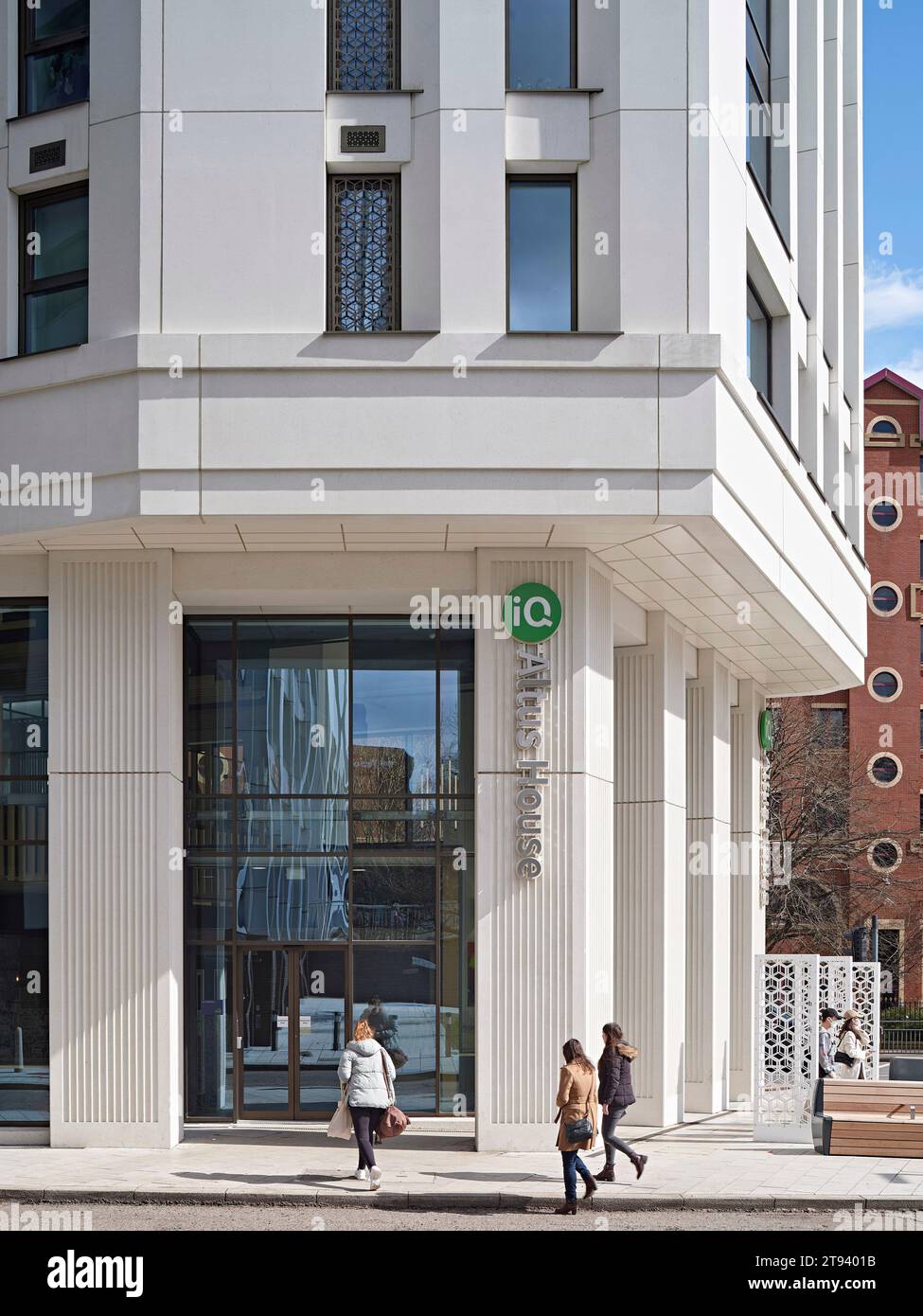 View along building facade with entrance. Altus House, Leeds, United ...
