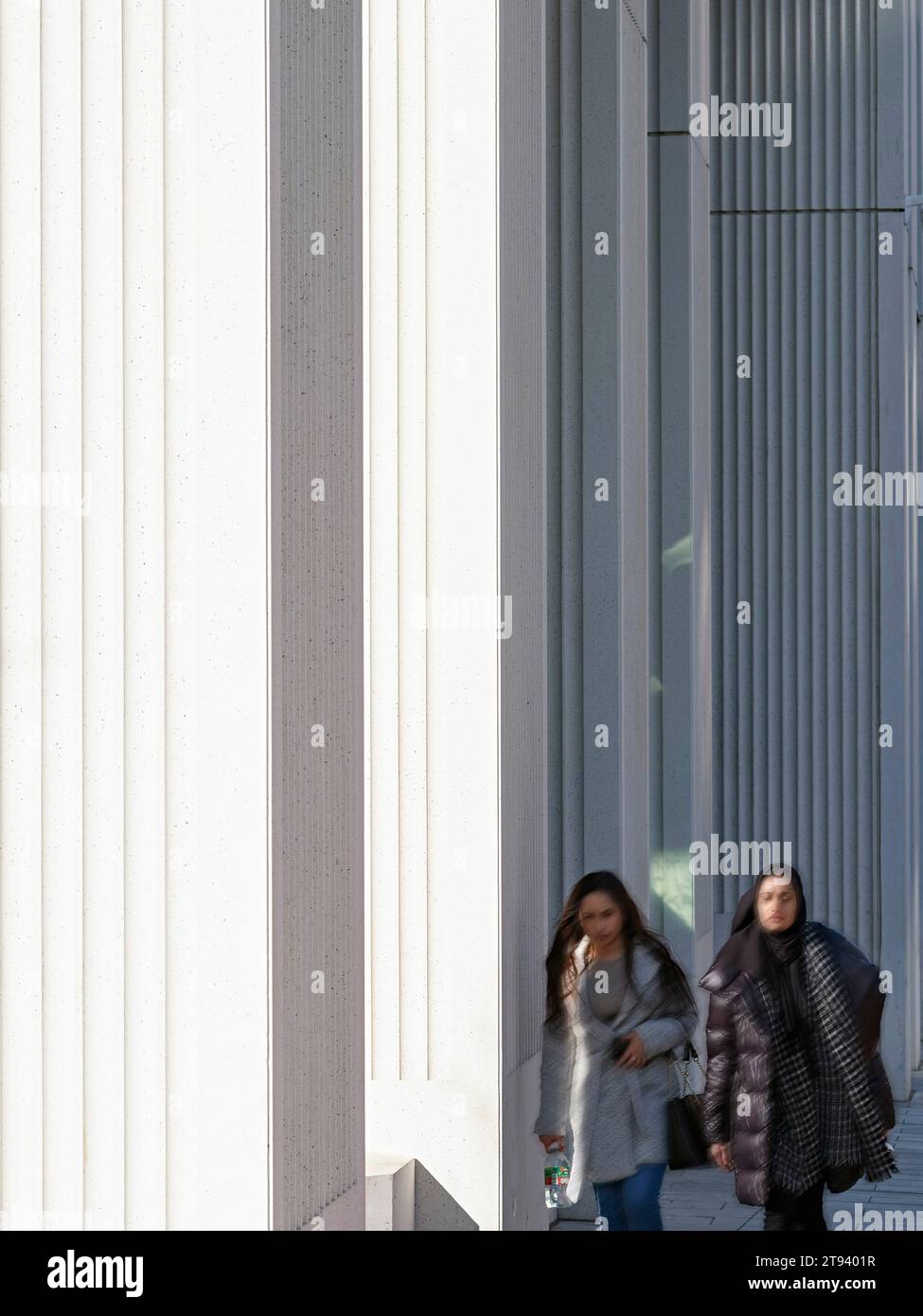 Facade detail and passersby. Altus House, Leeds, United Kingdom ...