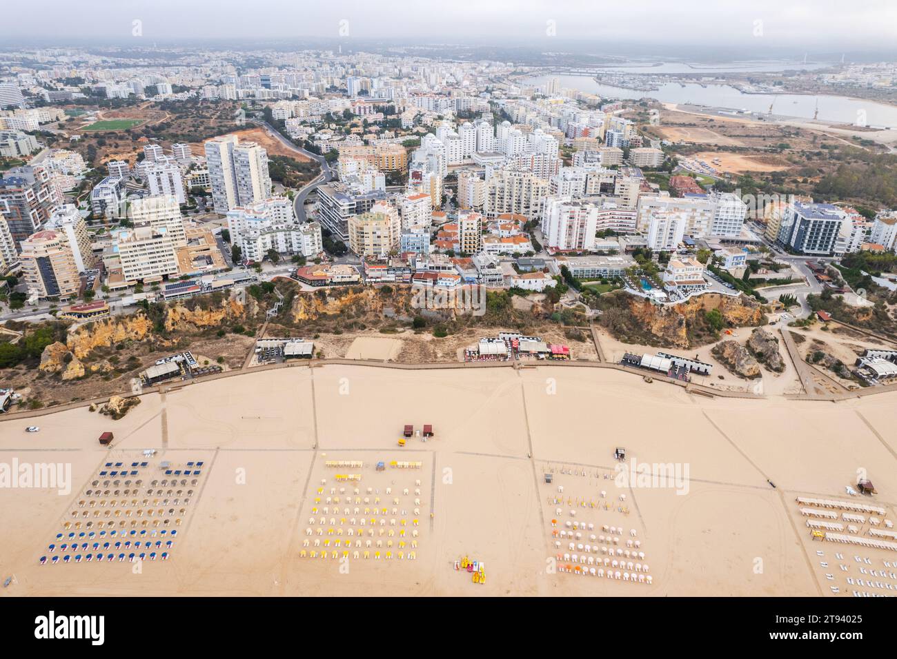 Aerial drone view of Portimao skyline and city beach of Praia da Rocha ...