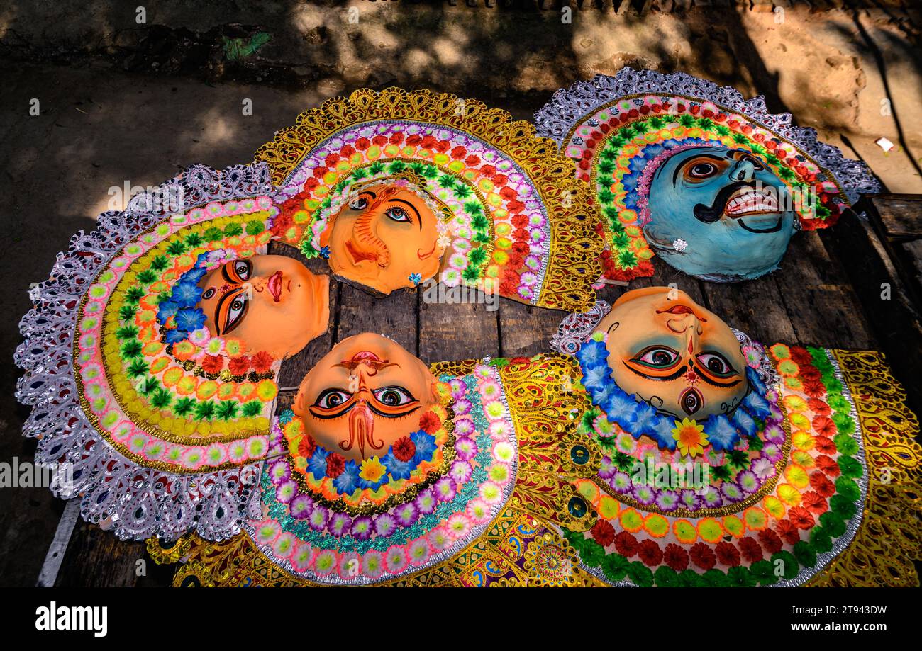 A village idol artist makes large color masks modeled after Purulia ...