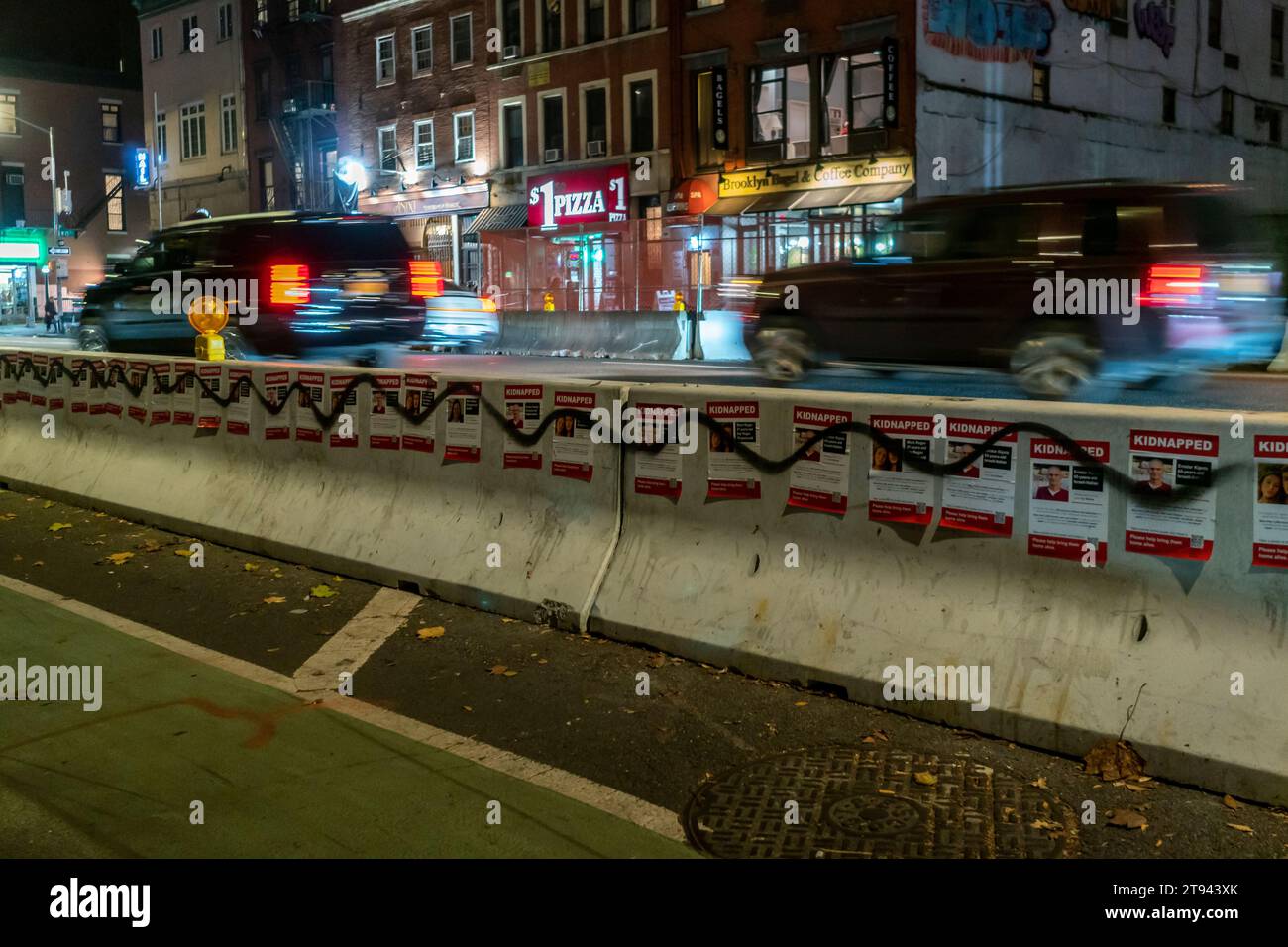 Vandalized kidnapped flyers are seen posted on jersey barricades in the ...