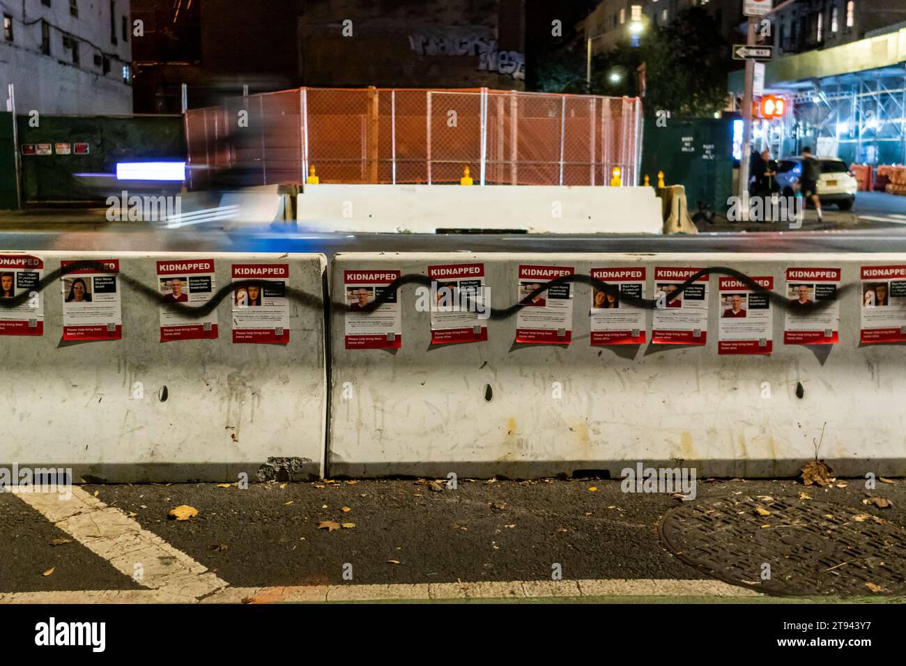 Vandalized kidnapped flyers are seen posted on jersey barricades in the ...