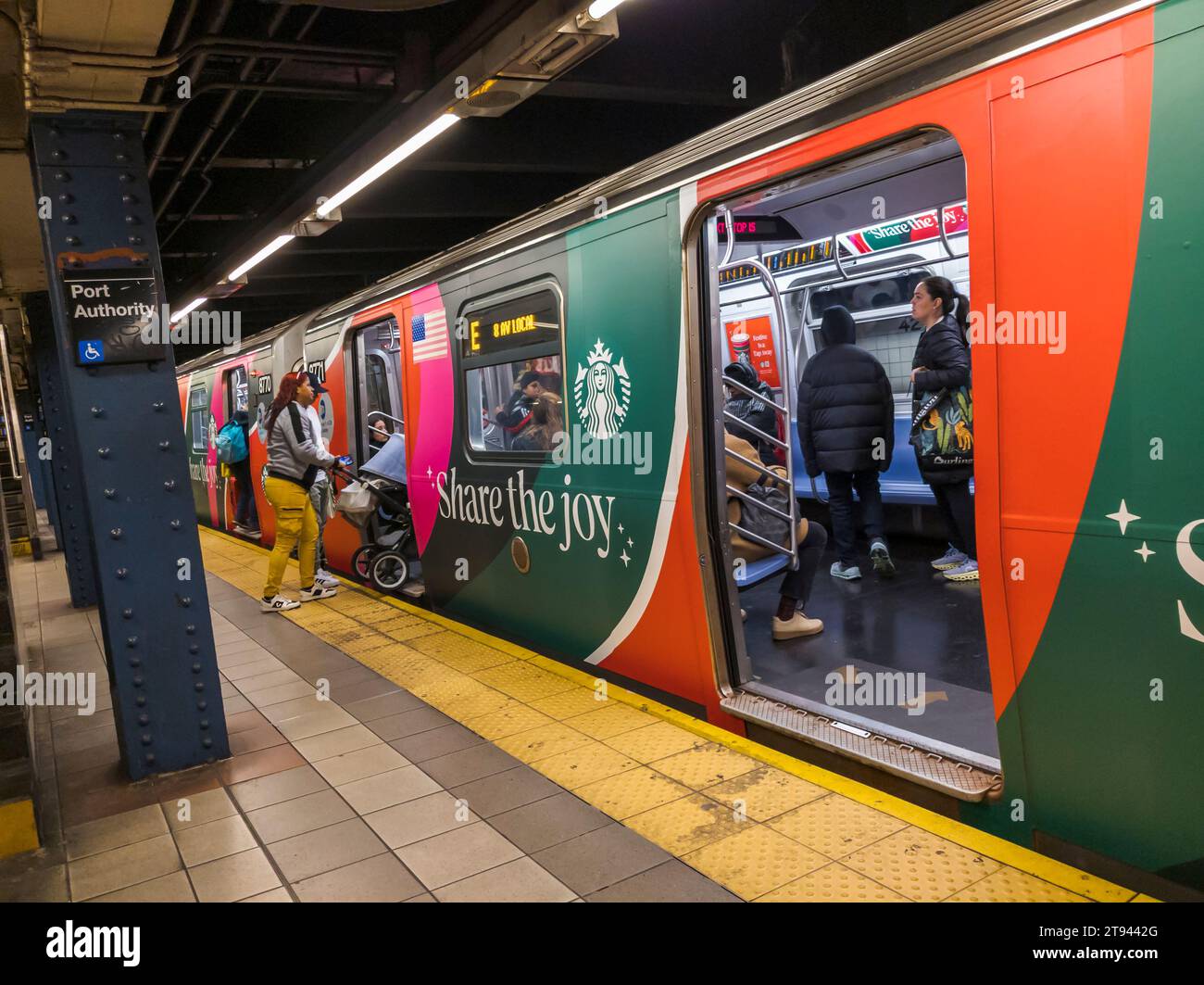 Starbucks advertising wrapped ÒEÓ train in the subway in New York on ...