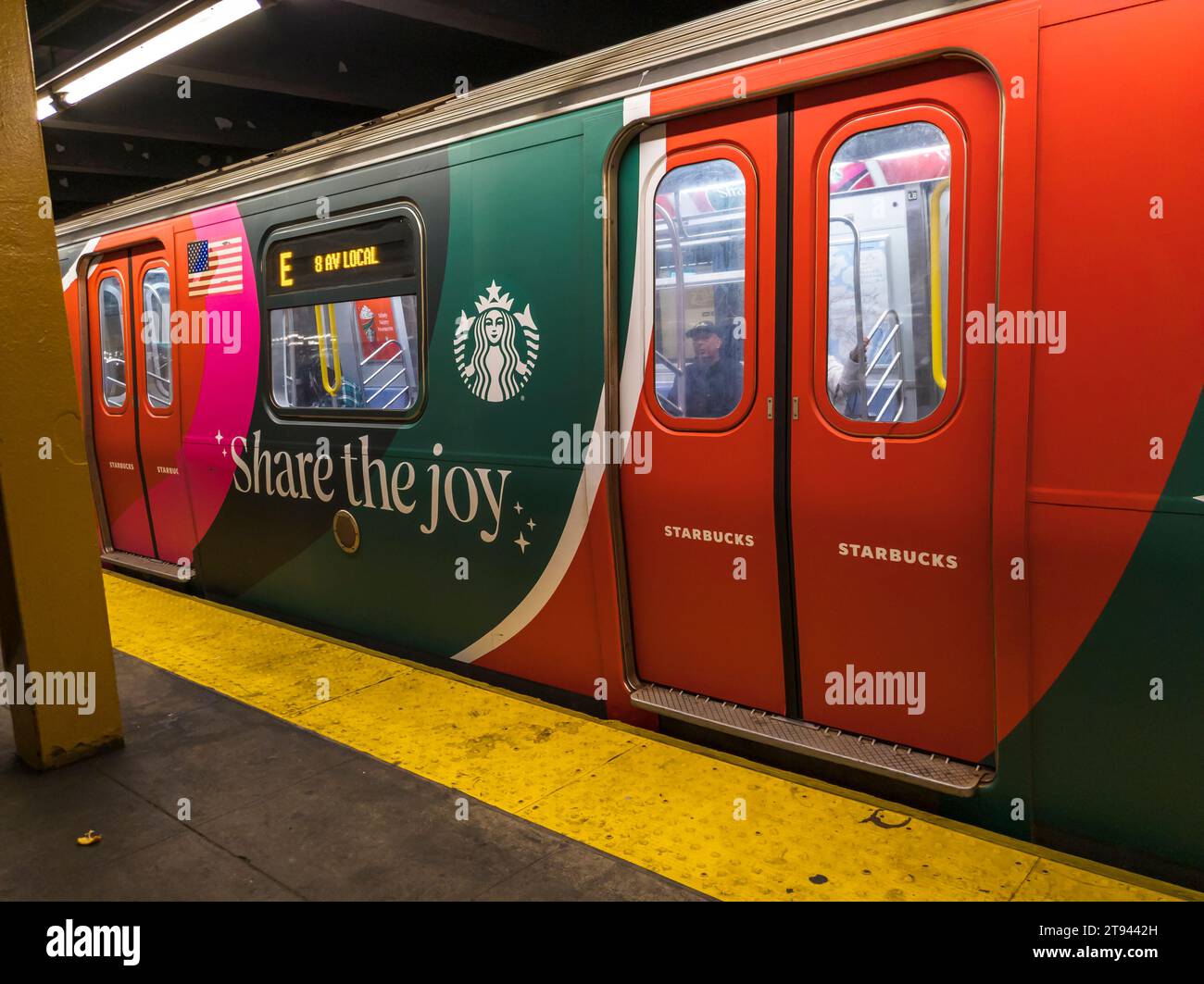 Starbucks advertising wrapped ÒEÓ train in the subway in New York on ...