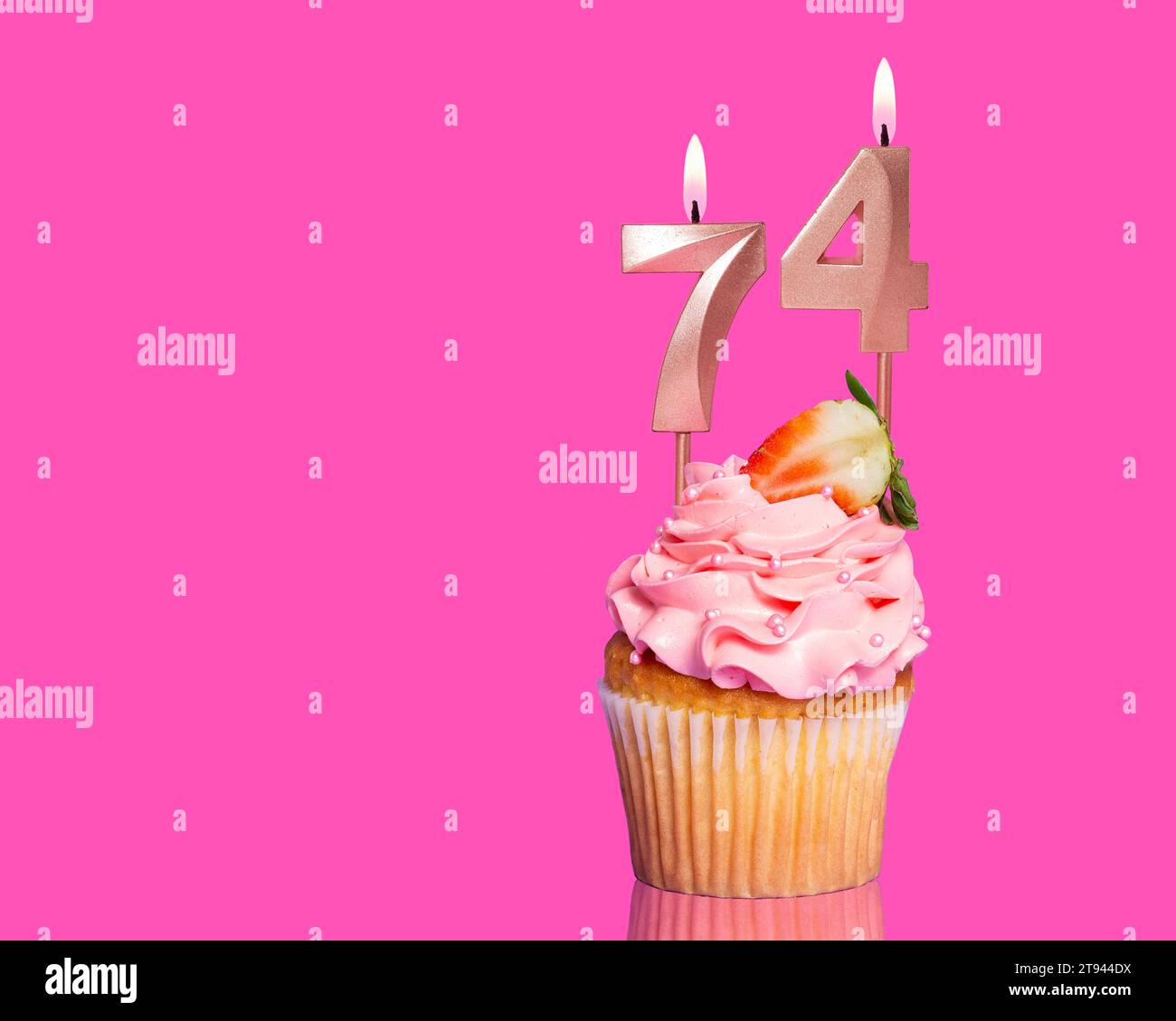 Birthday Cupcake With Candle Number 74 - On Hot Pink Background Stock ...