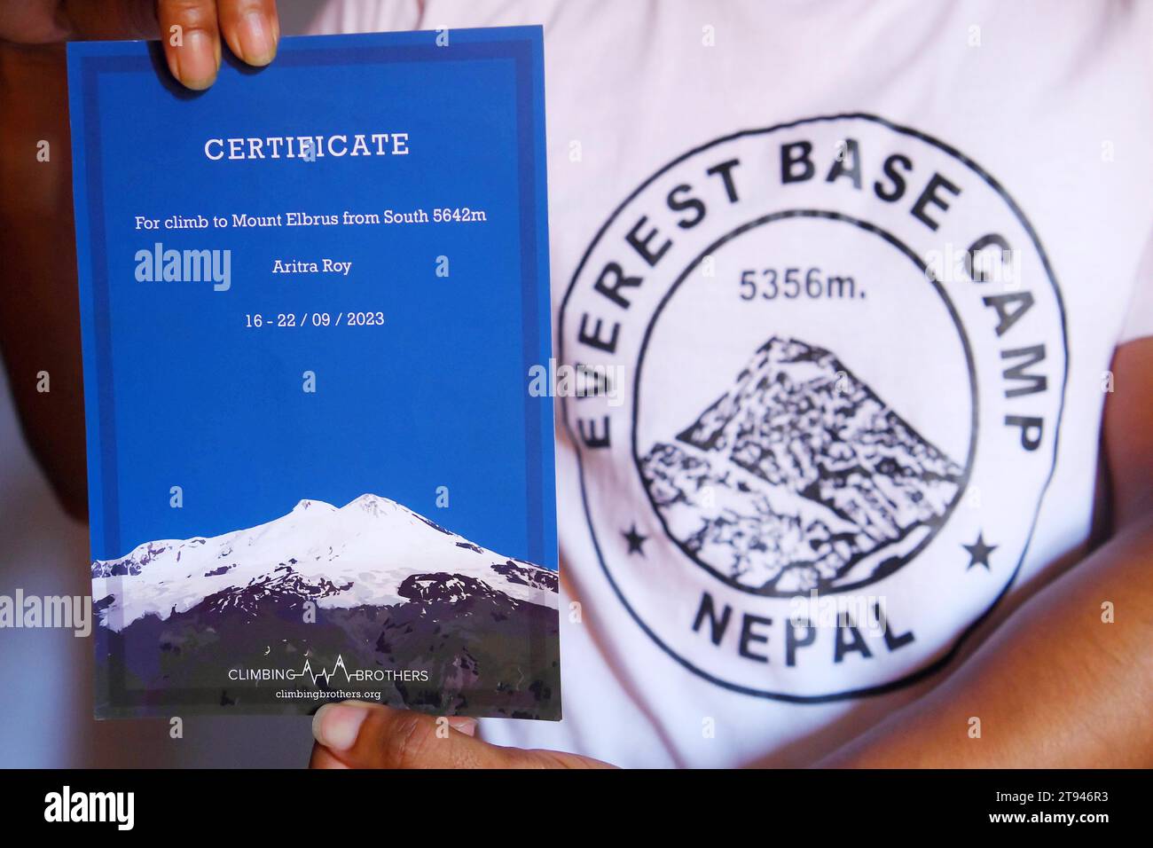 Aritra Roy, an IT professional and mountaineer, adjusting the spikes on ...