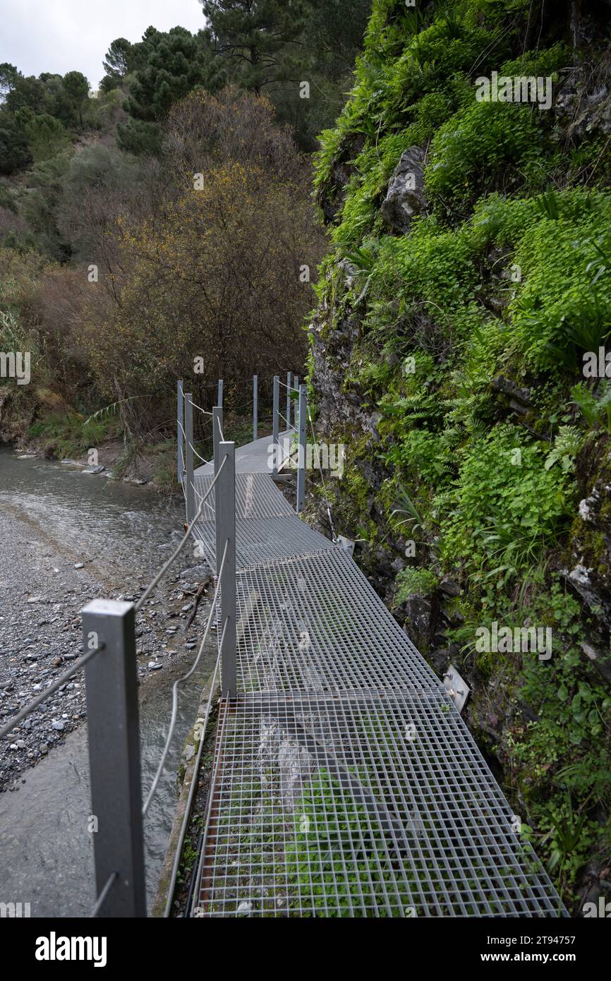 A metal pathway built alongside a cliff from the Pasarelas del Rio ...