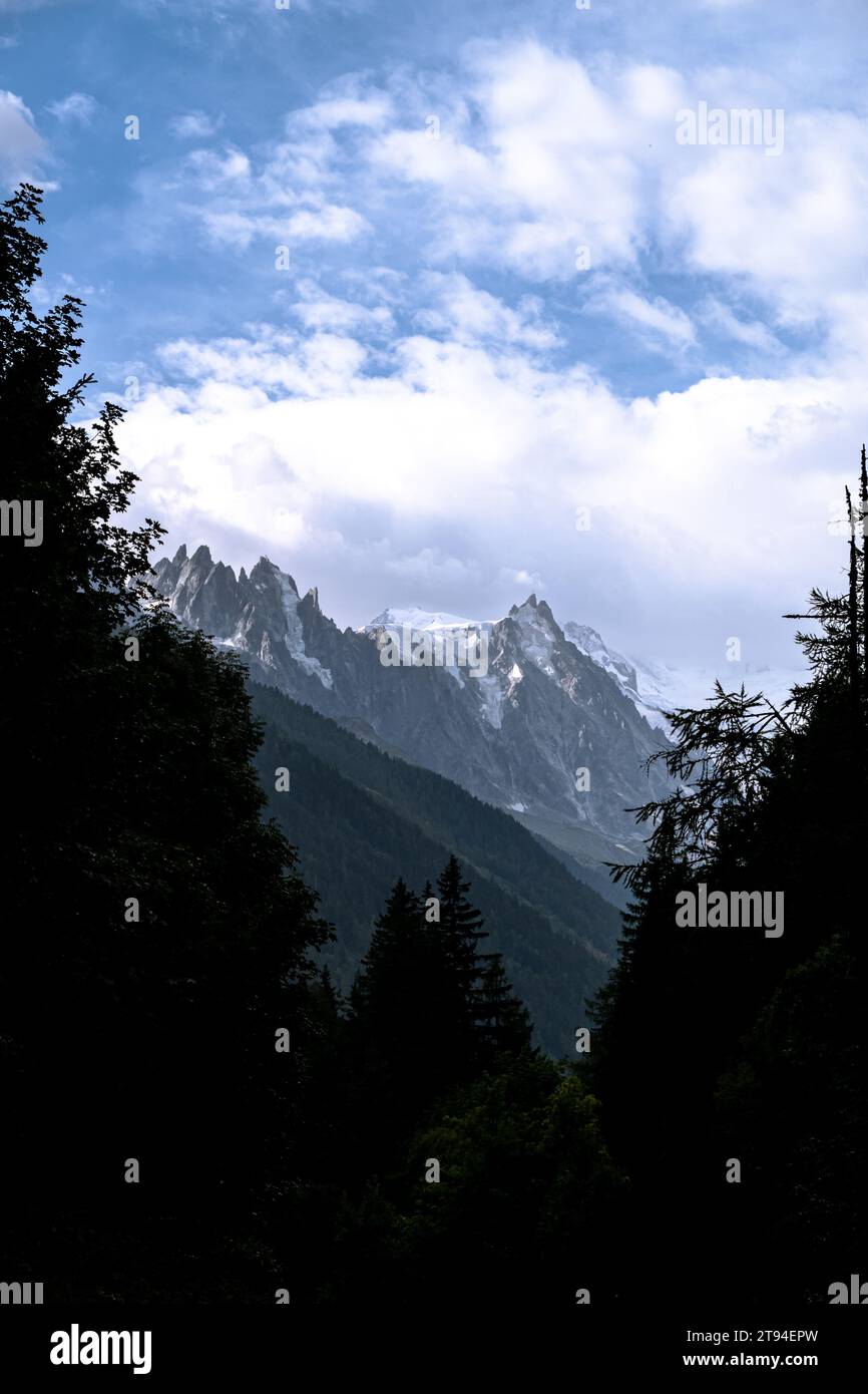 Storm clouds moving in over the Aiguilles de Mont Blanc mountain ridge ...