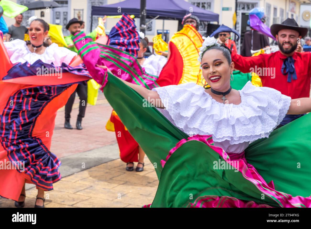 Folk dance group parading in the streets of San Jose, capital of Costa ...