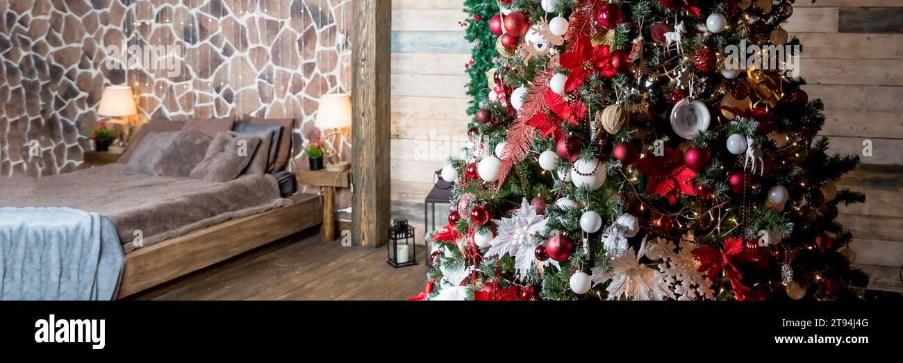 Christmas, New Year loft interior with bed, brick stone wall background ...