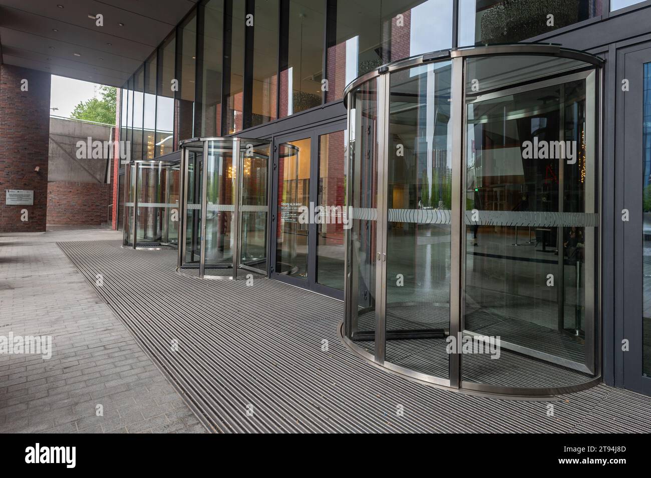 Facade of modern Business Center with glass doors Stock Photo - Alamy