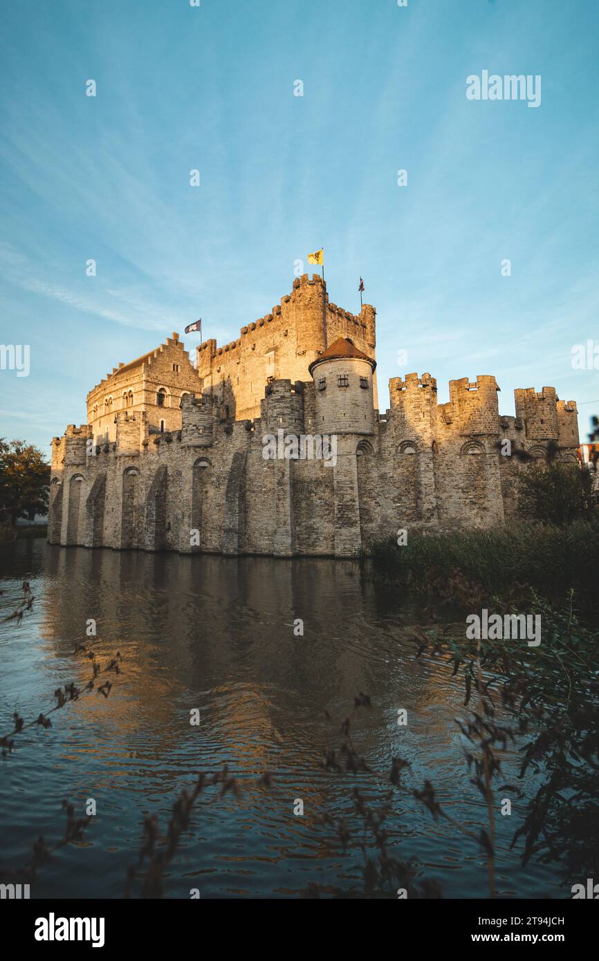 View of the medieval Gravensteen Castle and its reflection in the canal ...